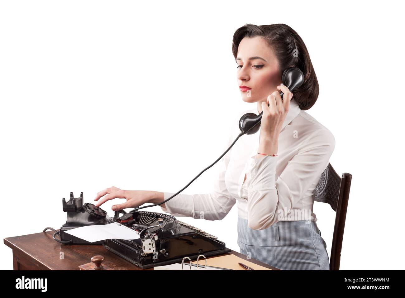 Beautiful efficient secretary sitting at desk in the office and working ...