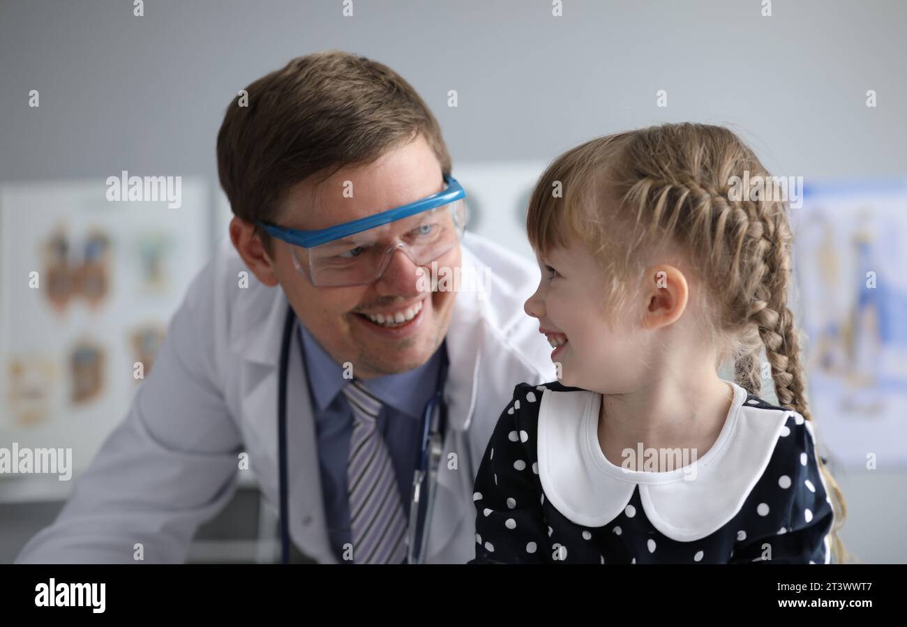 Child with cheerful doc Stock Photo - Alamy