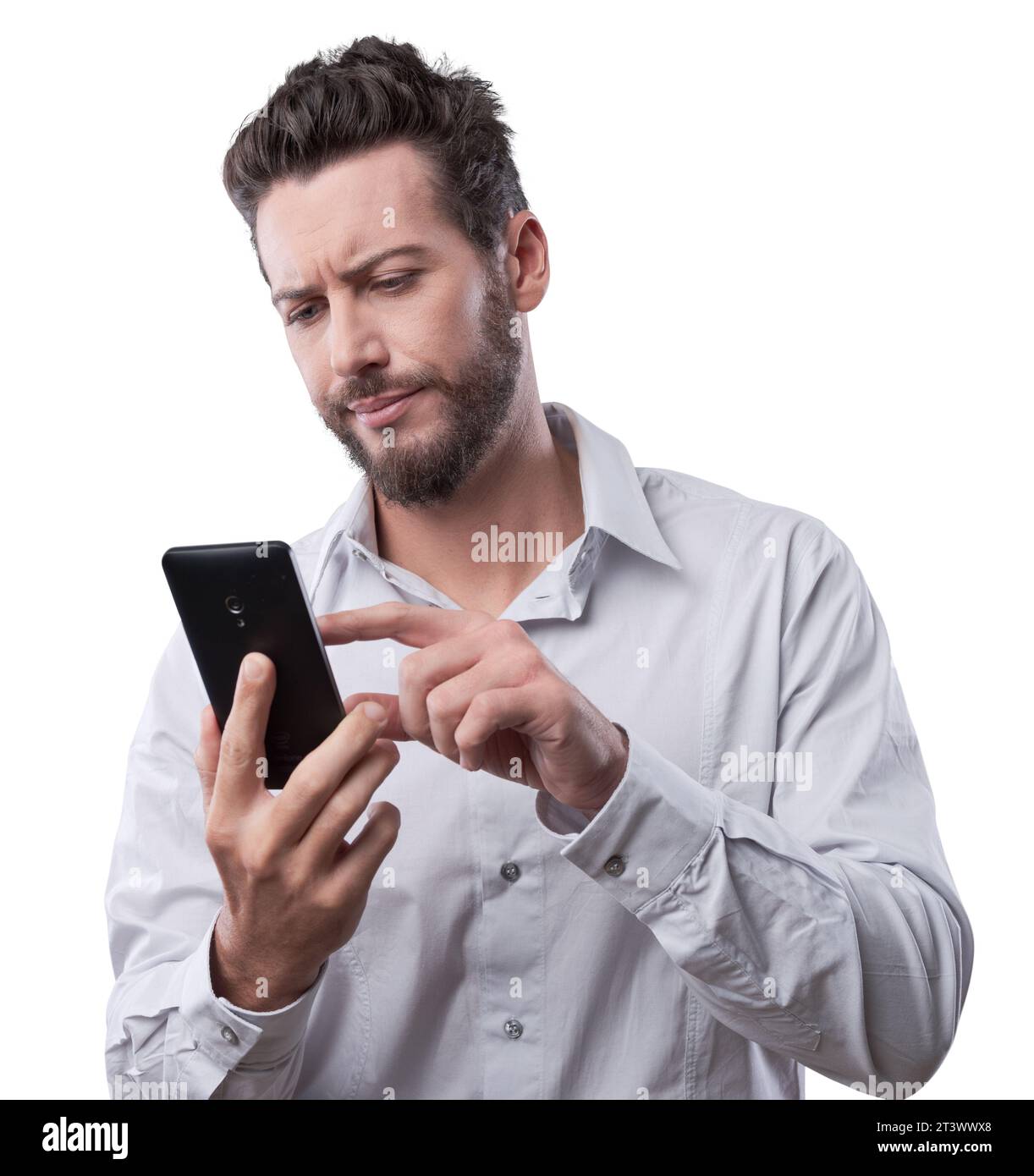 Disappointed young man typing on his touch screen smartphone Stock ...