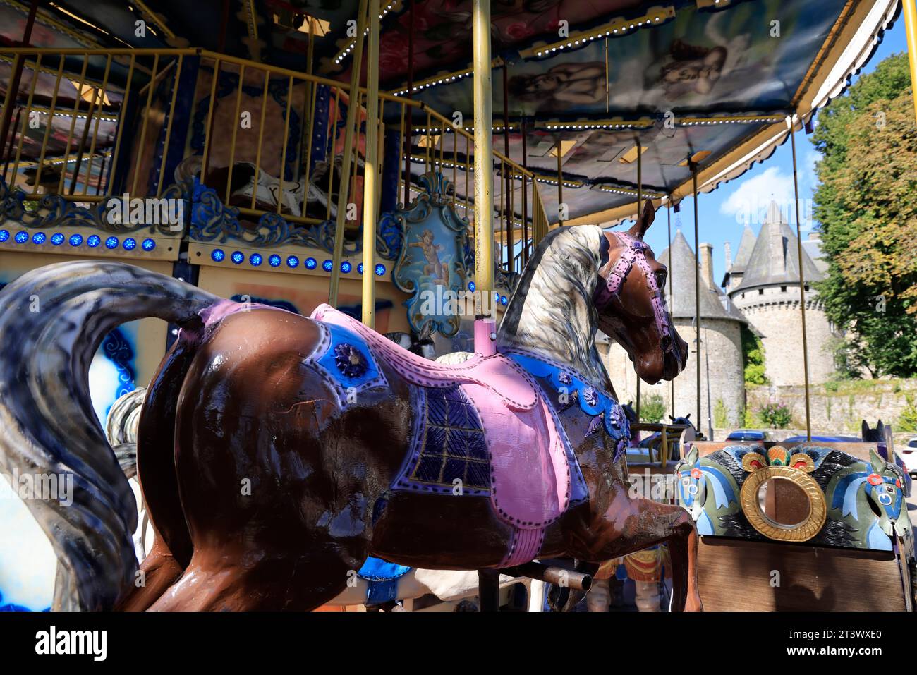 Wooden horses from the carousel in front of the Château de Pompadour ...