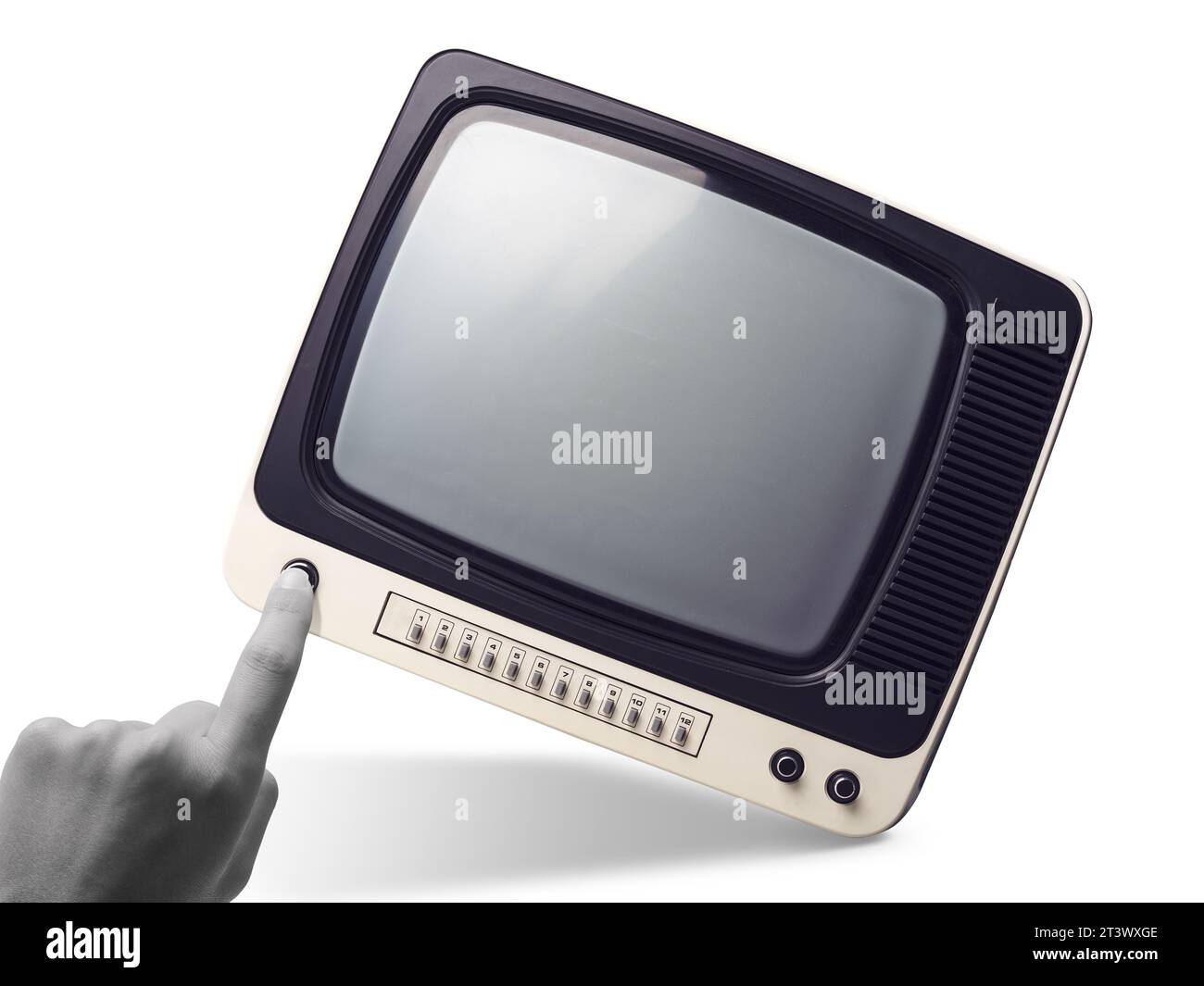 Woman touching a knob on a vintage TV: media and entertainment concept ...