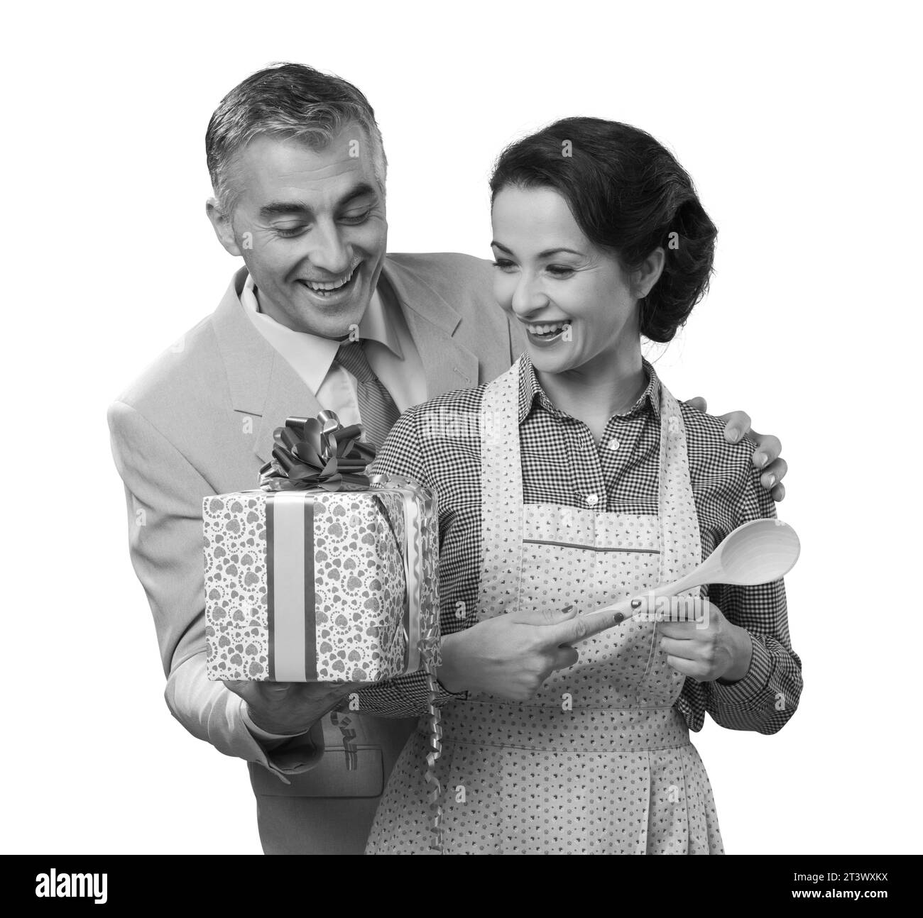 Vintage romantic couple at home, he is giving to his wife a beautiful ...