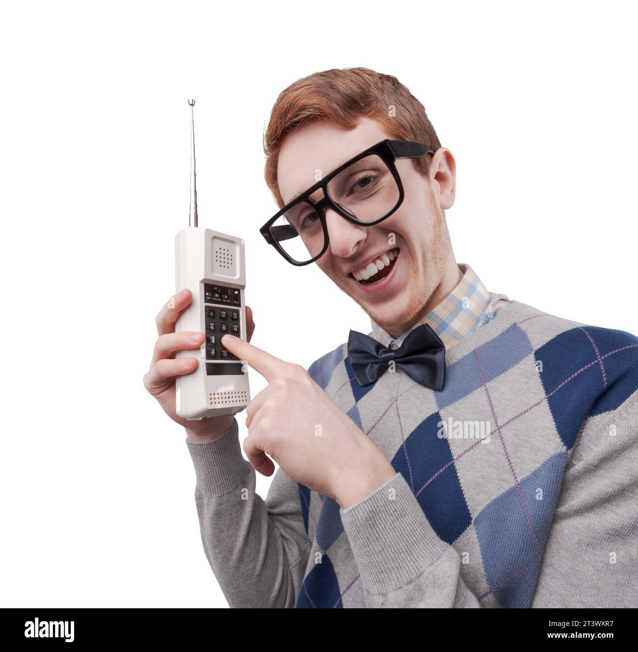 Funny nerd guy with big glasses holding a cordless phone and pushing a ...