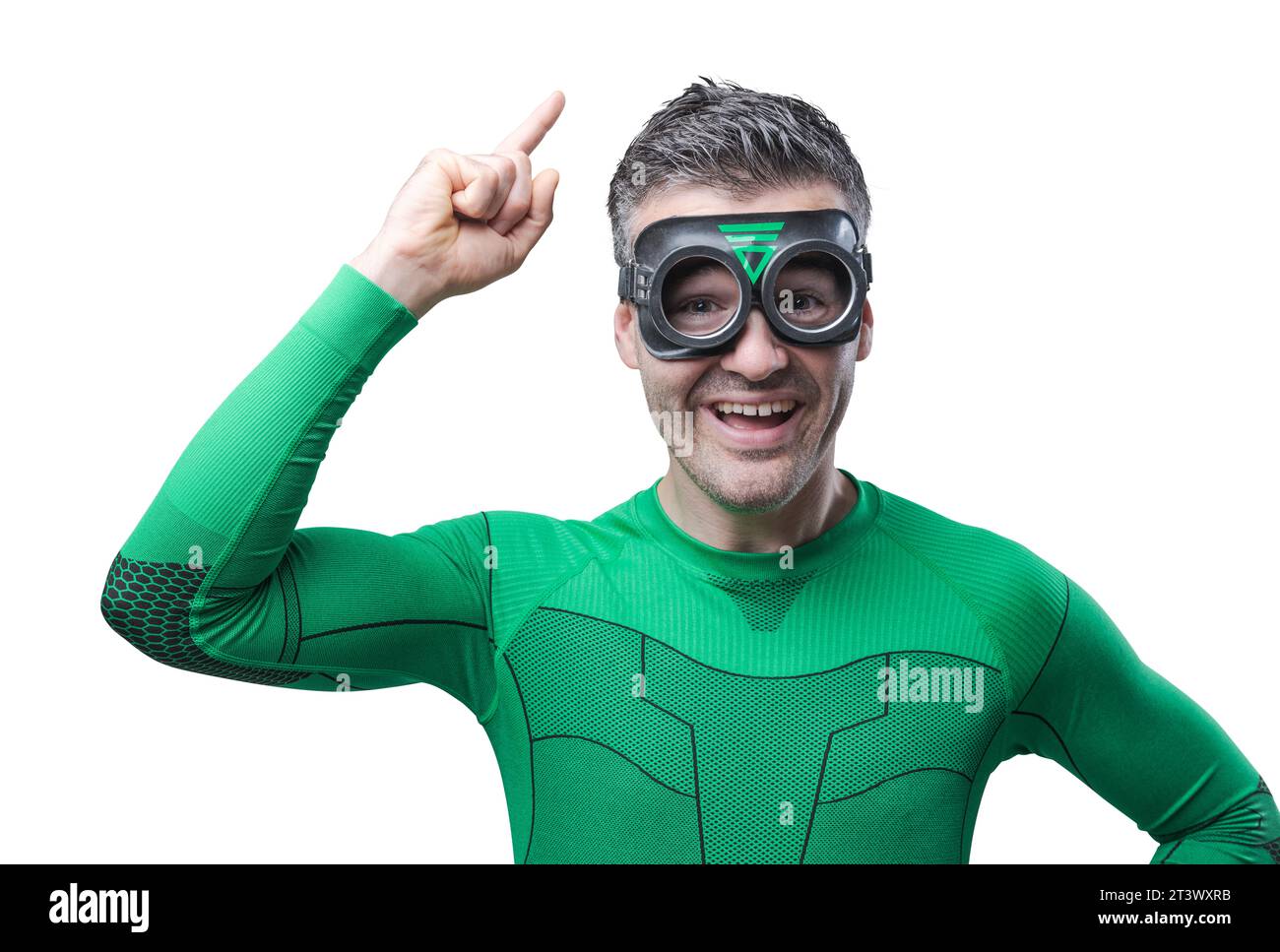Happy green superhero smiling at camera and pointing up Stock Photo - Alamy