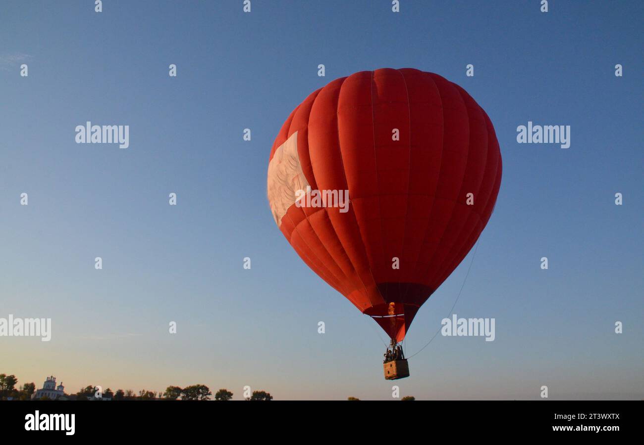 Hot air balloon, red color balloon flying. Sport equipment Stock Photo ...