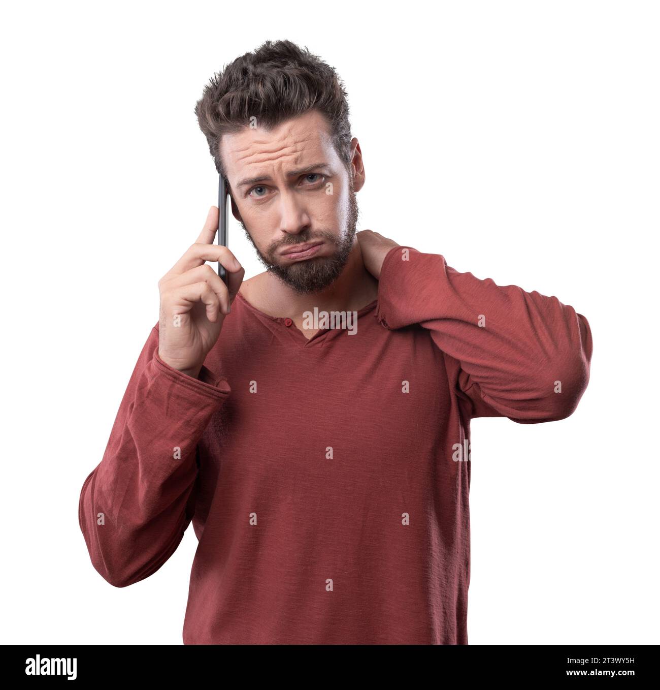 Young man having a boring phone call snorting and frowning Stock Photo ...