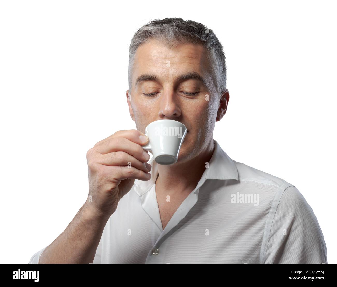Handsome confident man having a coffee break and drinking espresso ...