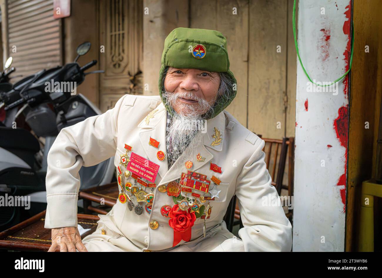 A high decorated elderly Vietnamese army veteran proudly displays his ...