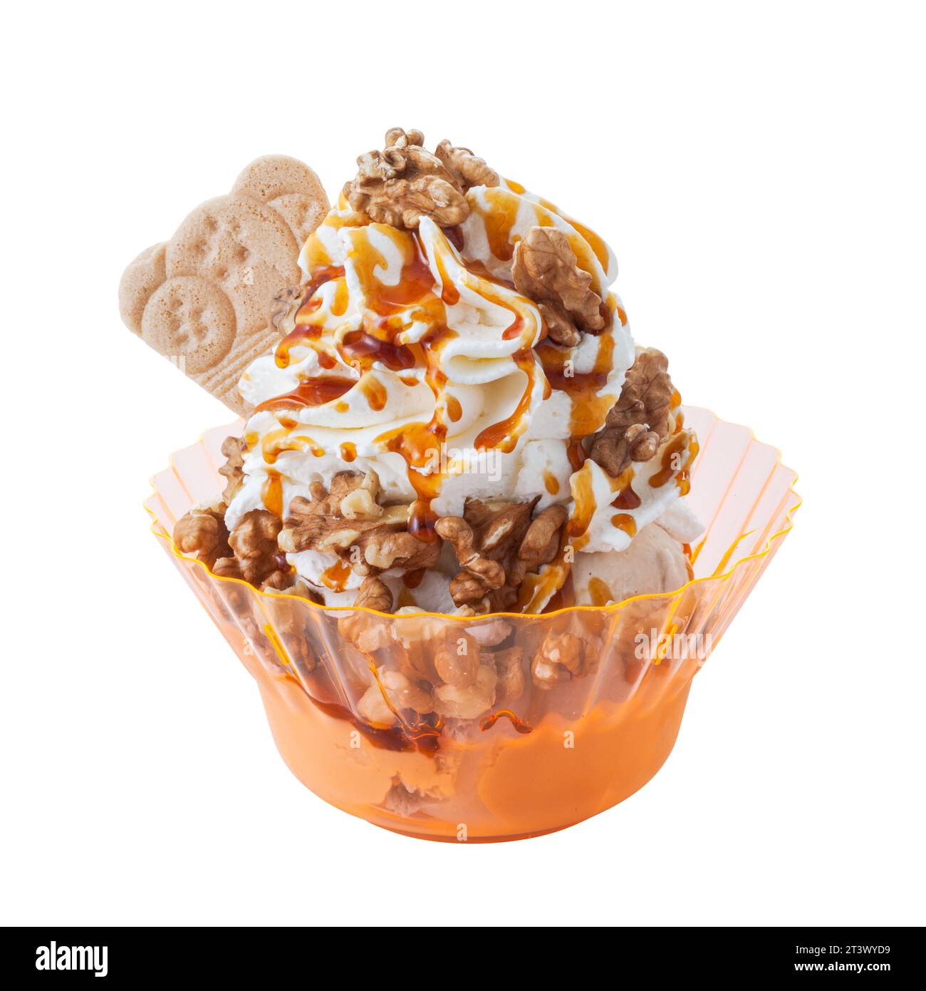 Delicious walnut ice cream sundae with wafer and toppings in a plastic ...