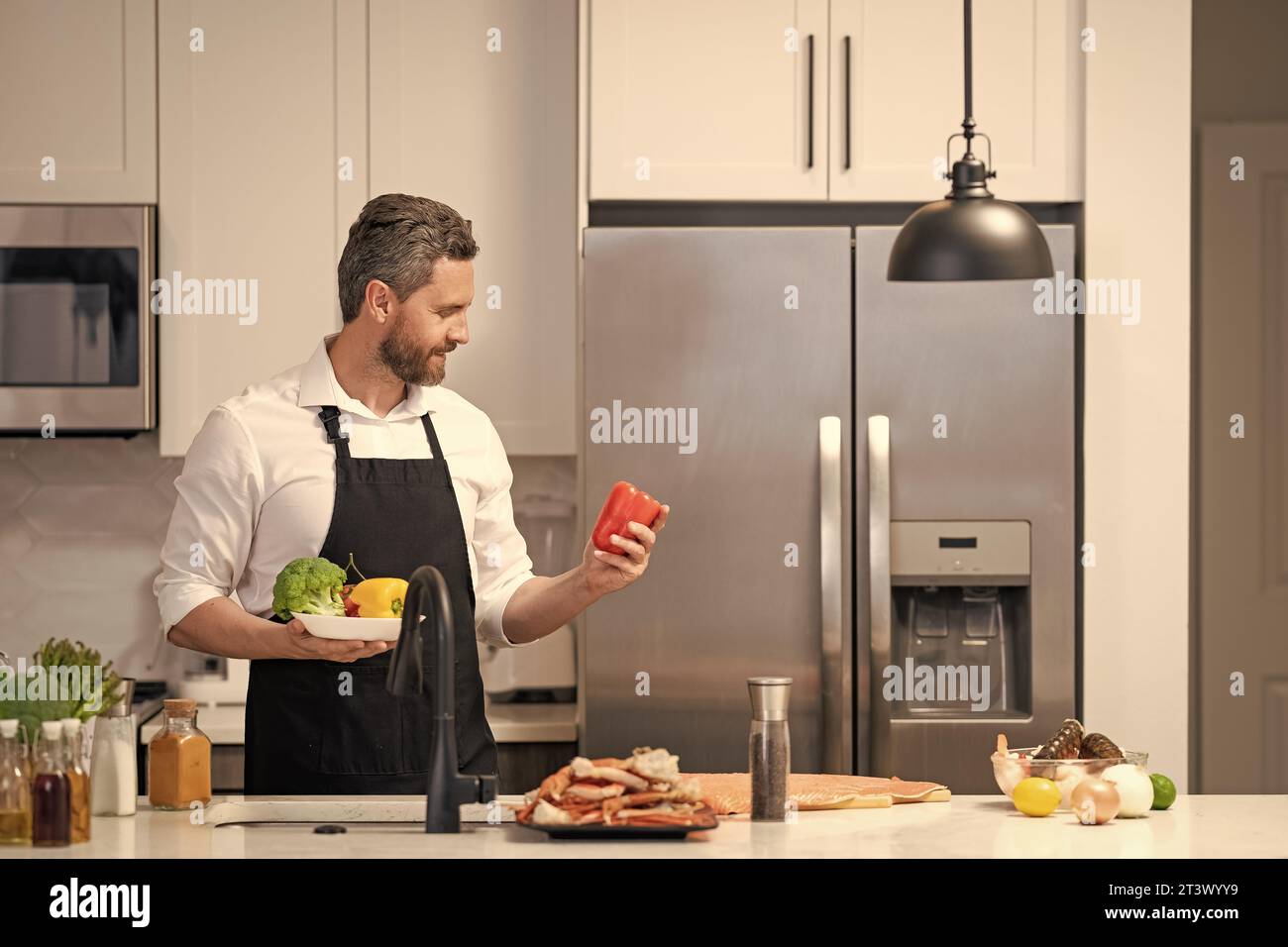 man cooking healthy food wearing apron, advertisement. man cooking ...