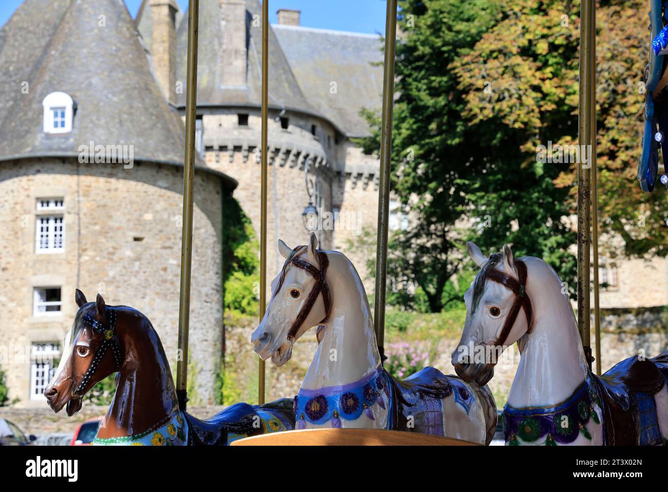 Wooden horses from the carousel in front of the Château de Pompadour ...