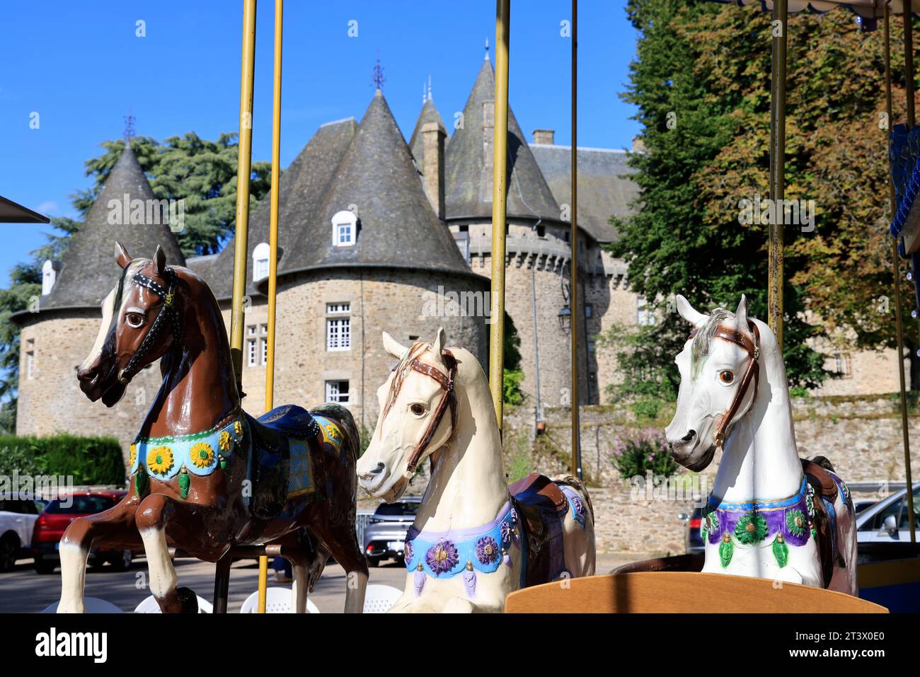 Wooden horses from the carousel in front of the Château de Pompadour ...