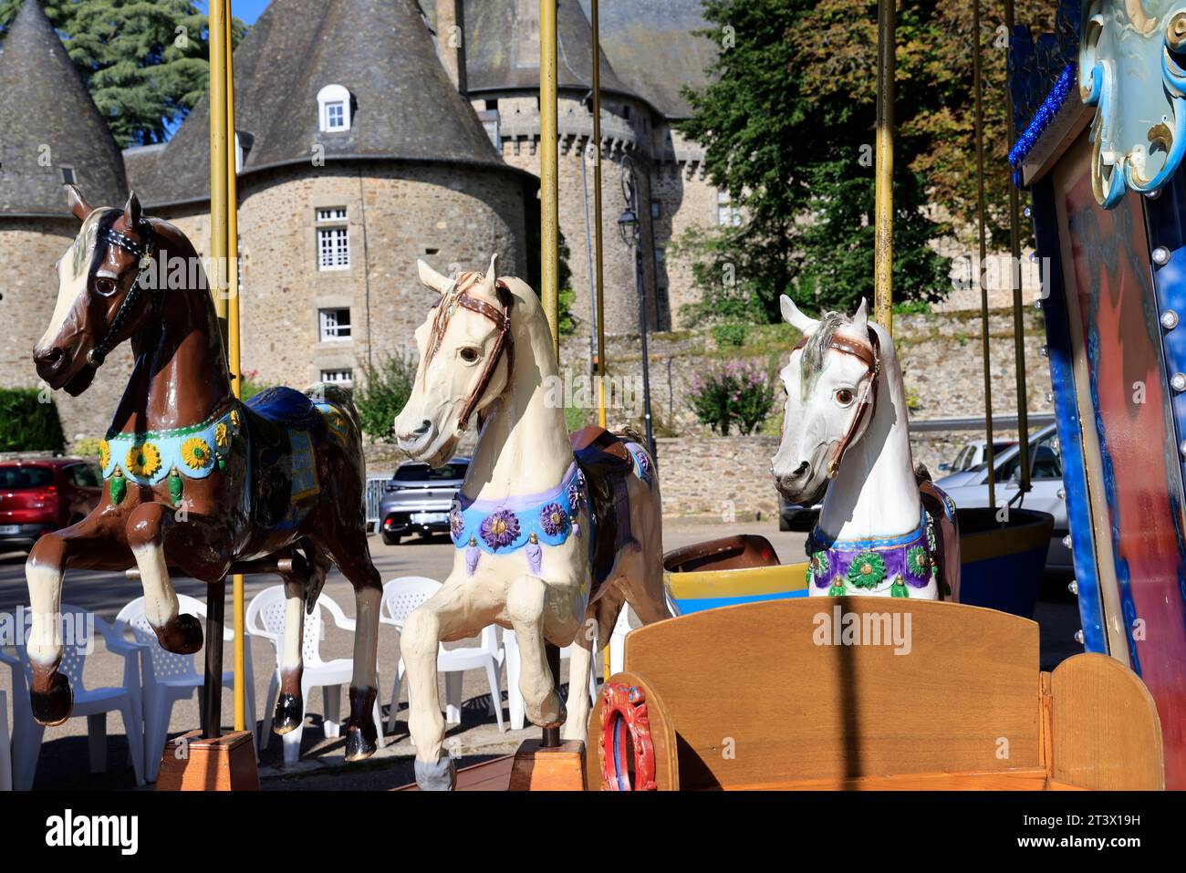 Wooden horses from the carousel in front of the Château de Pompadour ...