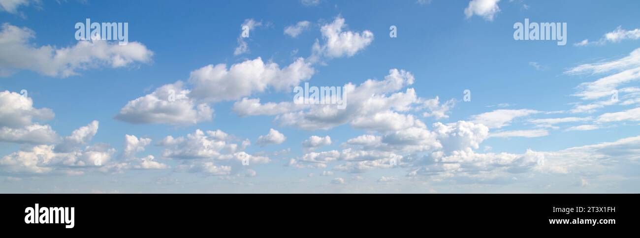 White fluffy clouds fly in sky. White cloud with many other clouds ...