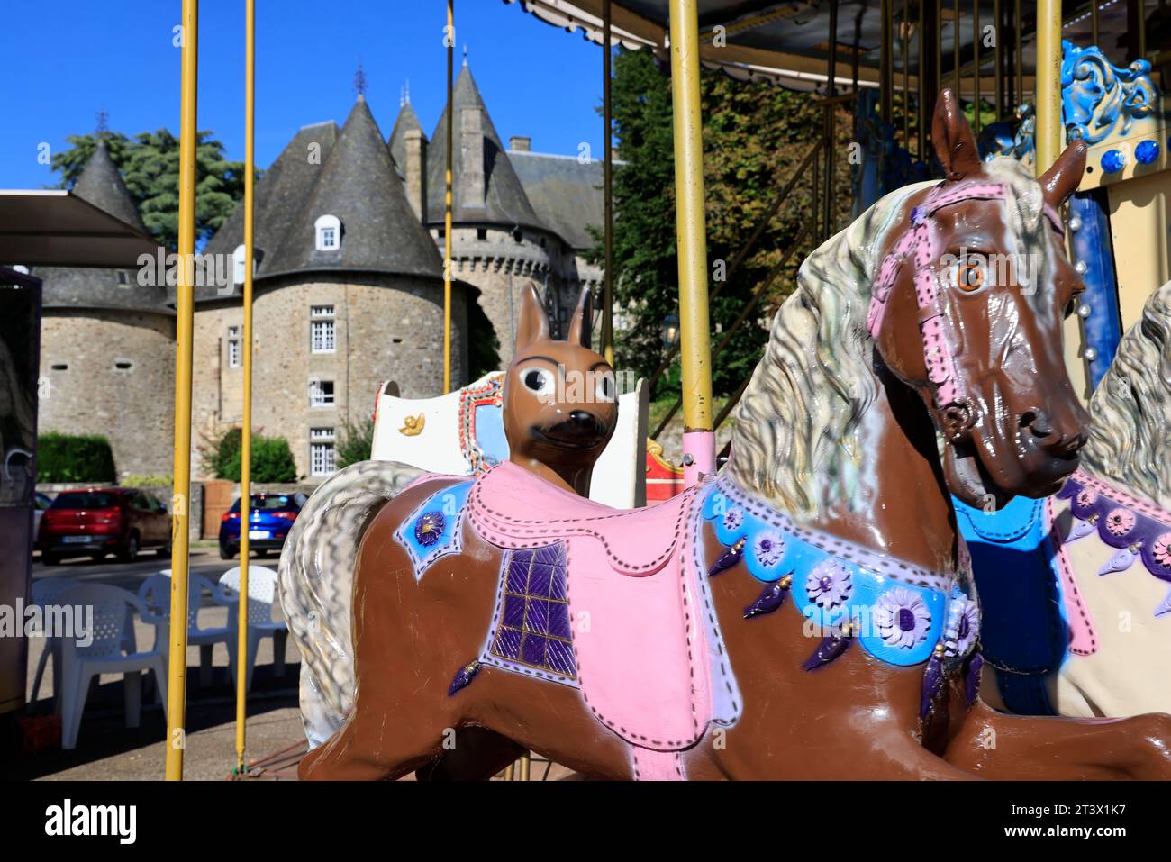 Wooden horses from the carousel in front of the Château de Pompadour ...
