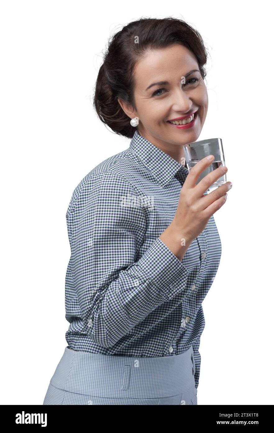 Attractive 1950s style woman drinking a glass of water Stock Photo - Alamy