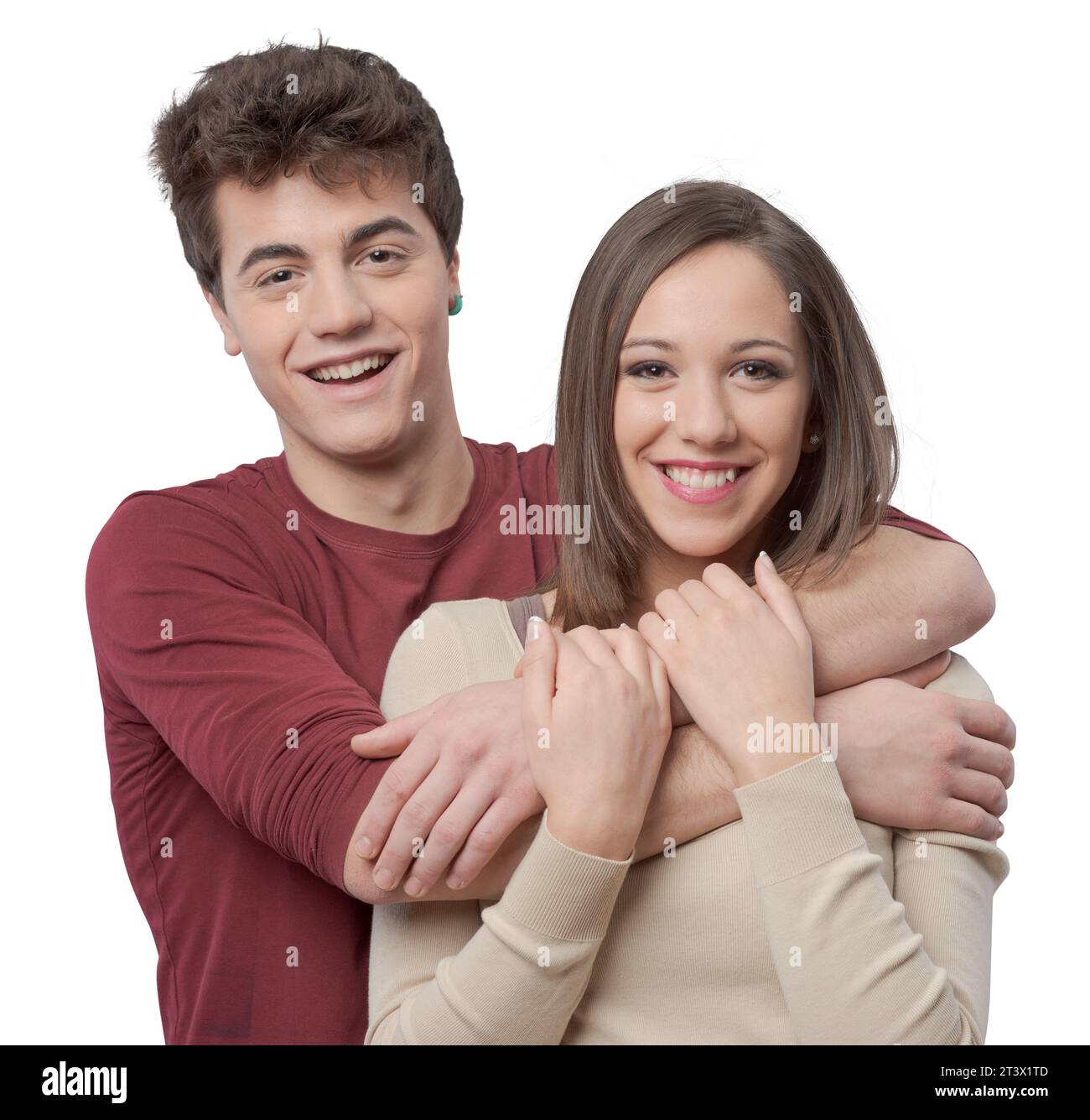 Happy young loving couple hugging and smiling at camera Stock Photo - Alamy