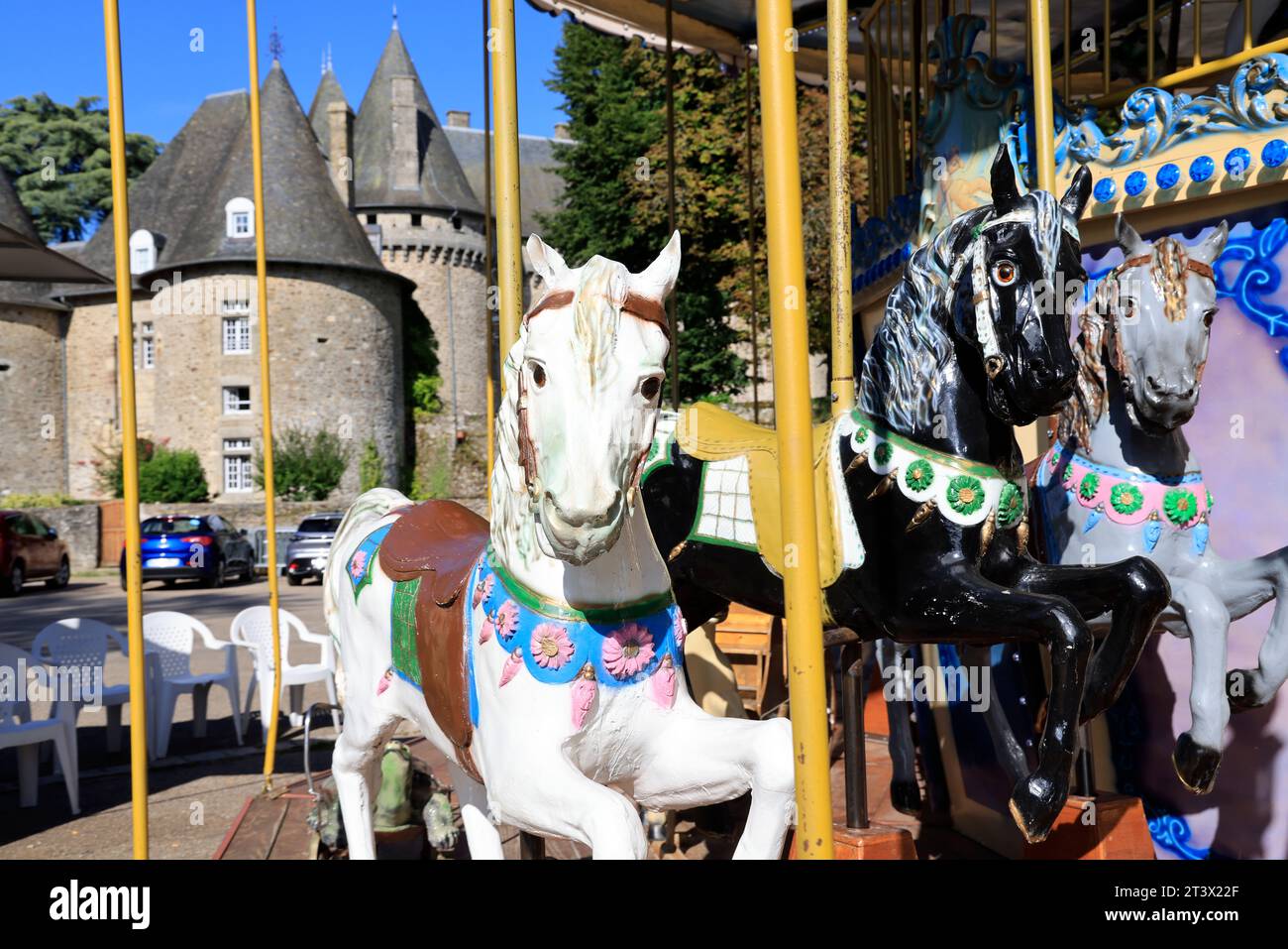 Wooden horses from the carousel in front of the Château de Pompadour ...
