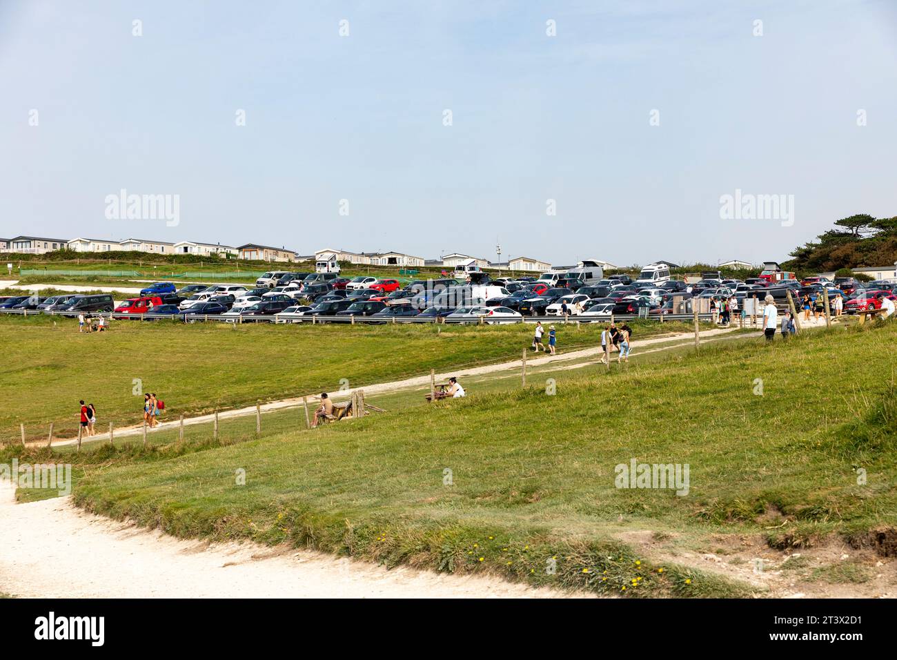 Durdle Door car park on the Jurassic coast, visitors and tourists walk ...