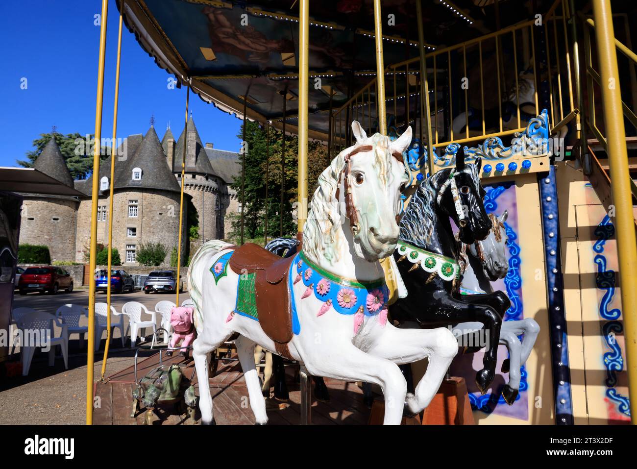 Wooden horses from the carousel in front of the Château de Pompadour ...