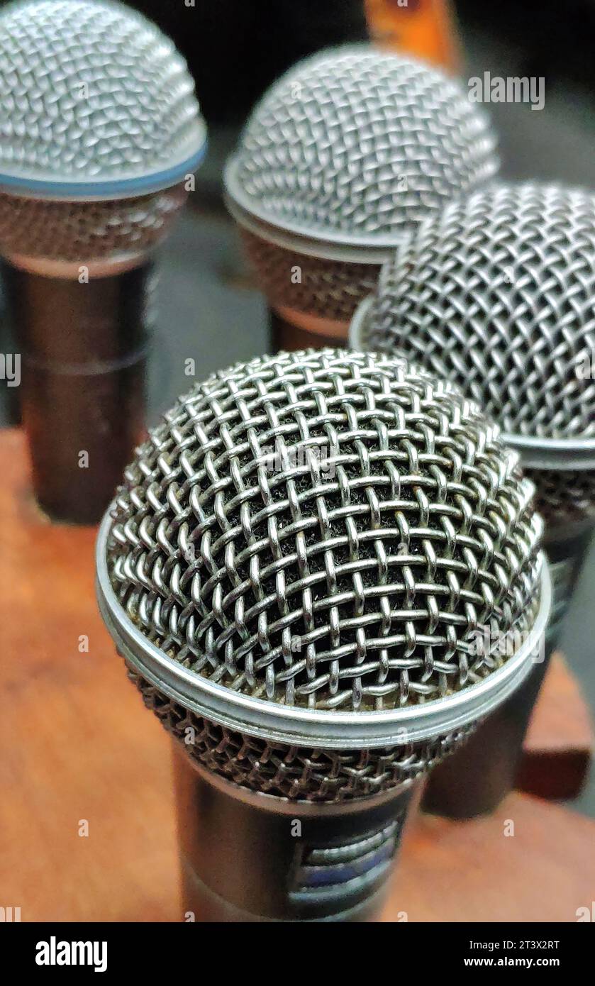 Microphones close-up macro view, music background with many microphones ...