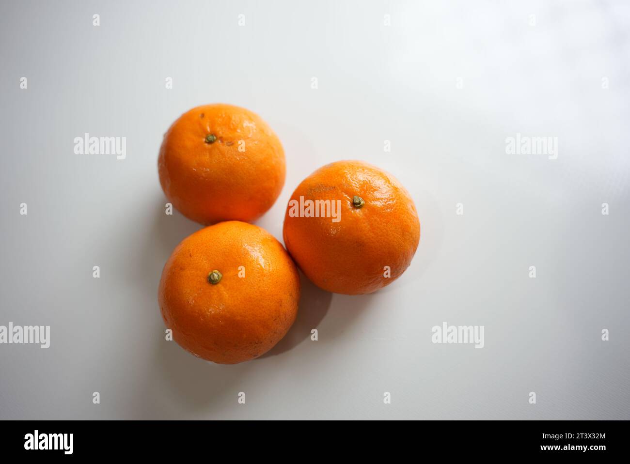 Fresh oranges with white background Stock Photo - Alamy