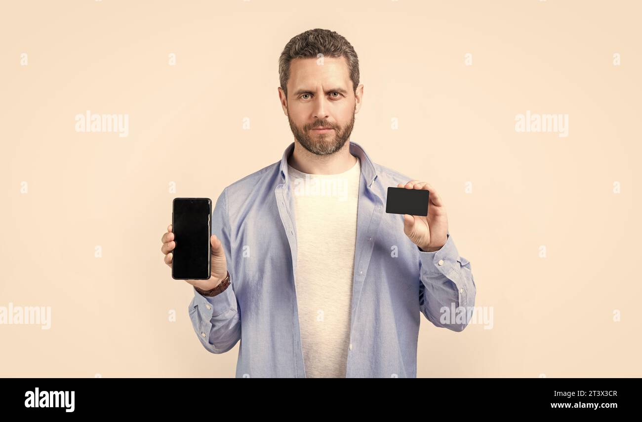 man paying transaction isolated on studio background. man paying ...