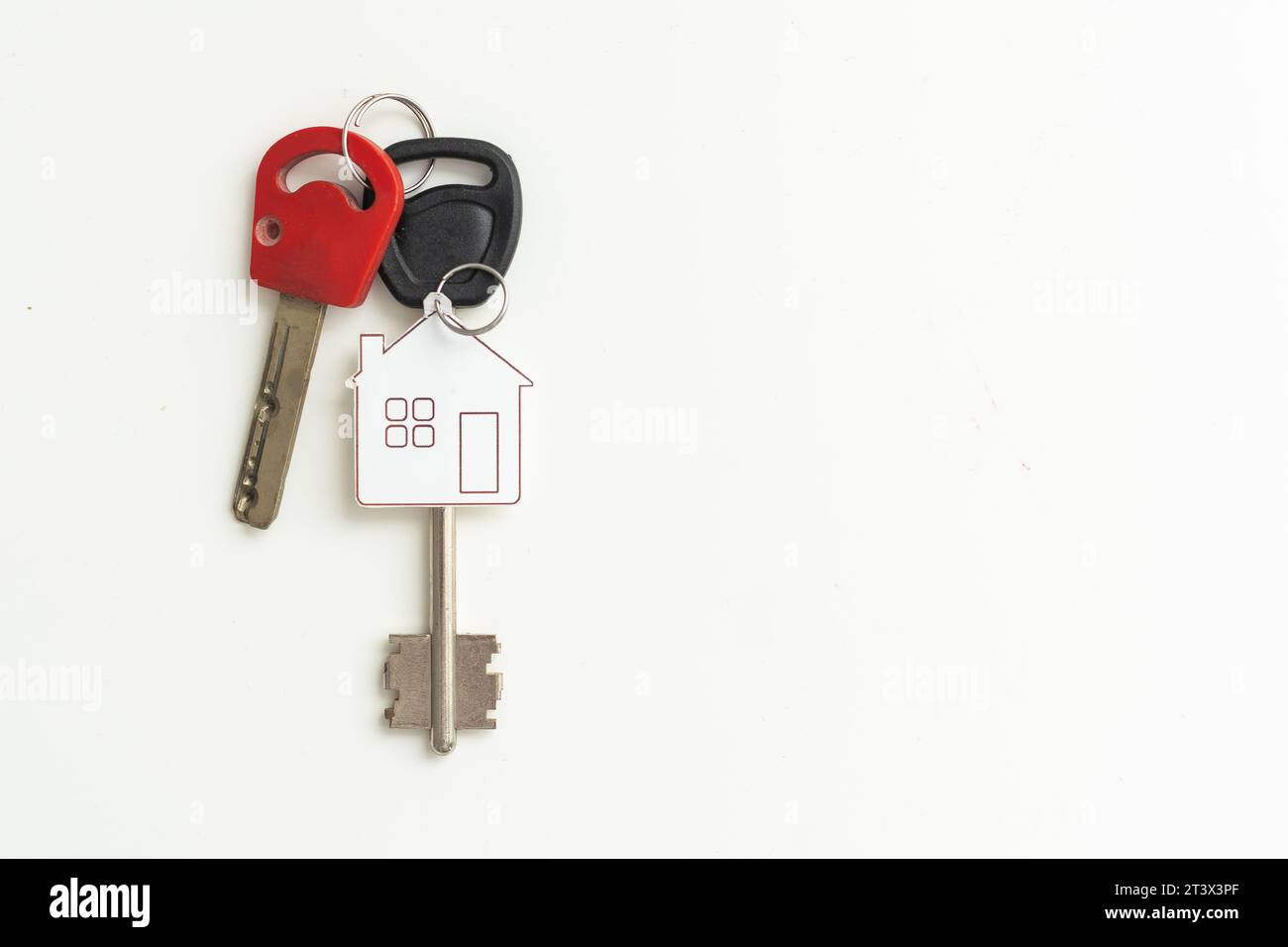 House keys with keychain. Isolated on white background Stock Photo - Alamy
