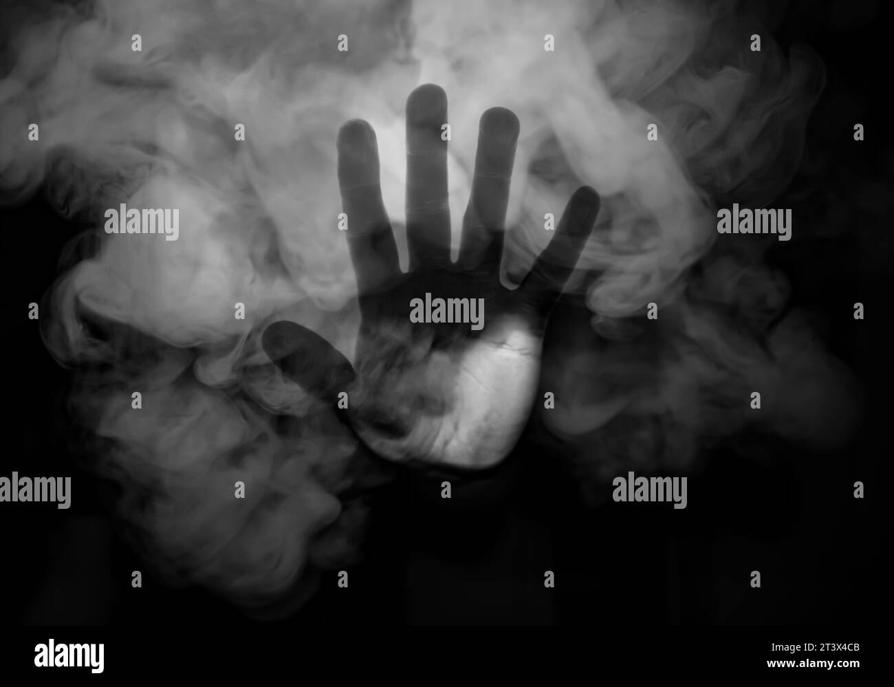 Hand in smoke in black and white Stock Photo - Alamy