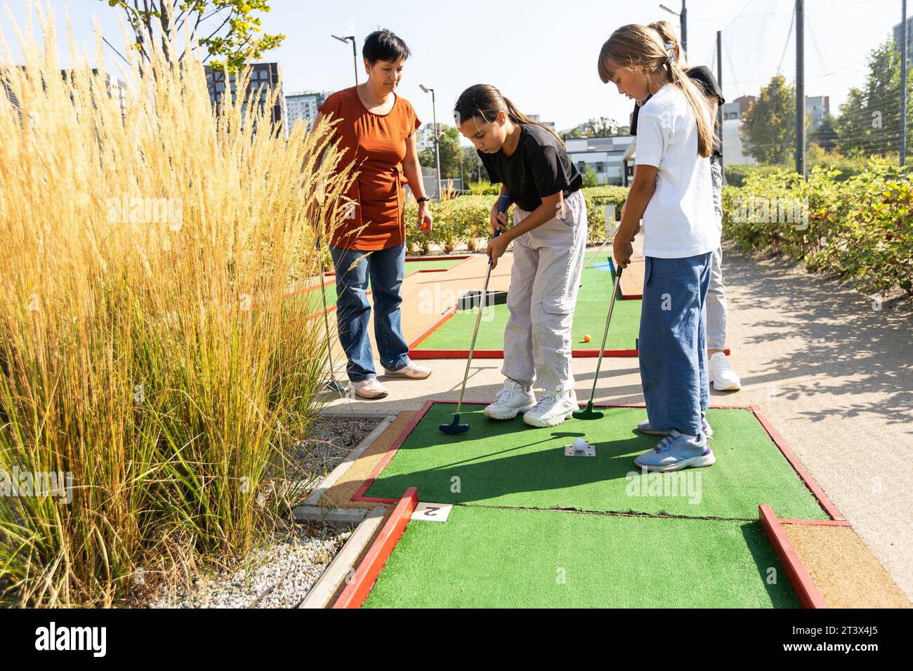 Golf course group of friends people with children posing standing Stock ...