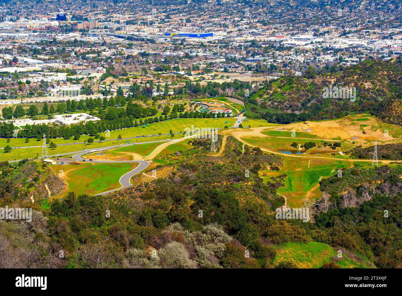 Aerial cityscape of Los Angeles with green hills as seen from the ...