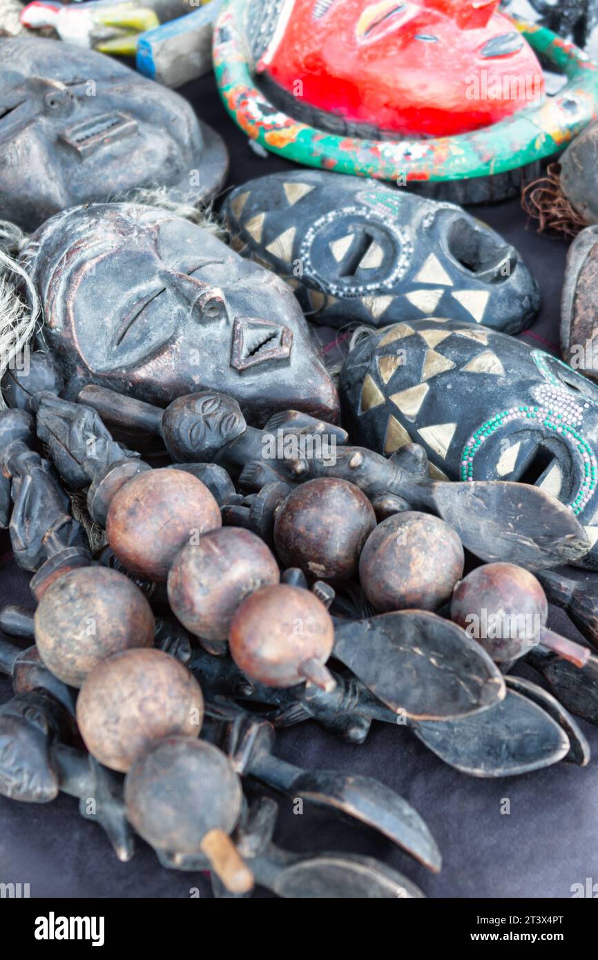 wooden african ancient masks and sculptures at a flea market , polished ...