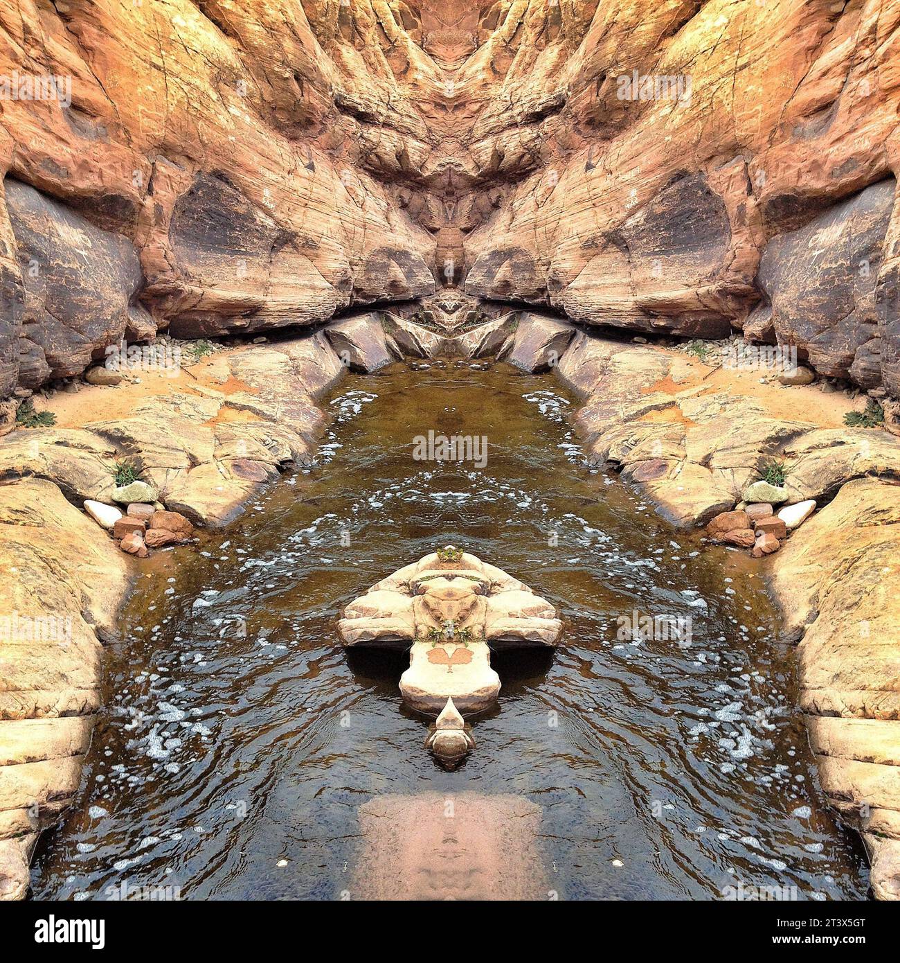 Mirrored image of rocks and water.PLEASE NOTE: This image is part of ...