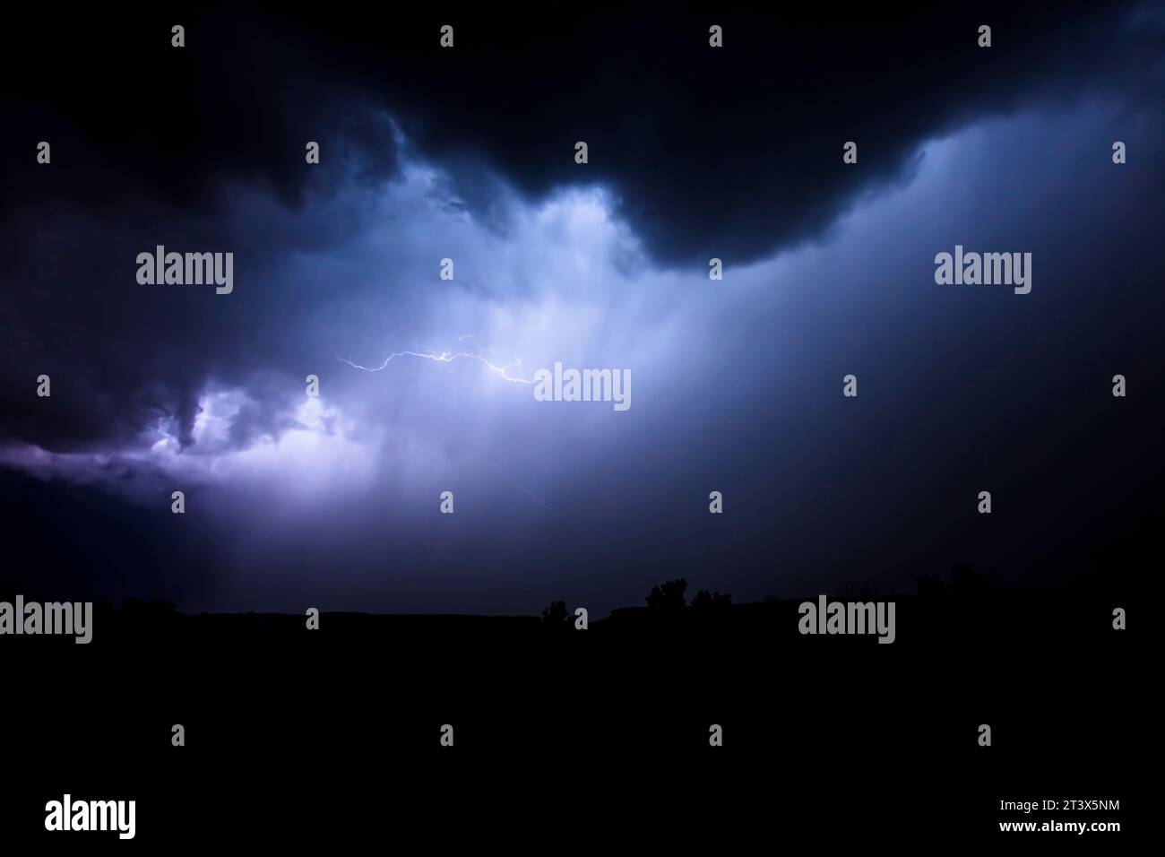 Lightning and storm clouds at night Stock Photo - Alamy