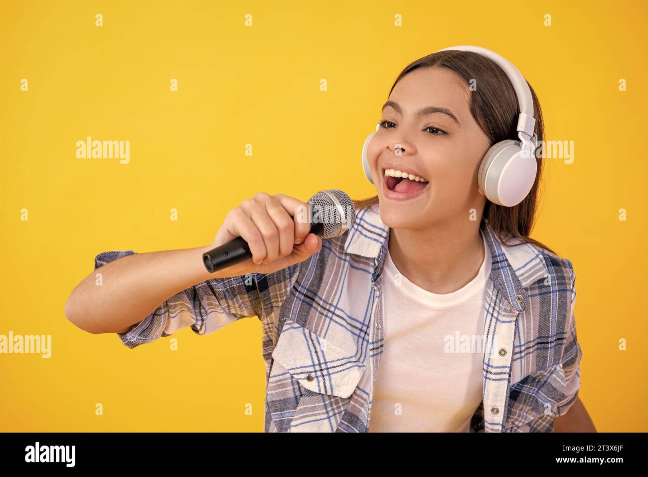 happy teenage singer girl singing music on background. singer girl with ...