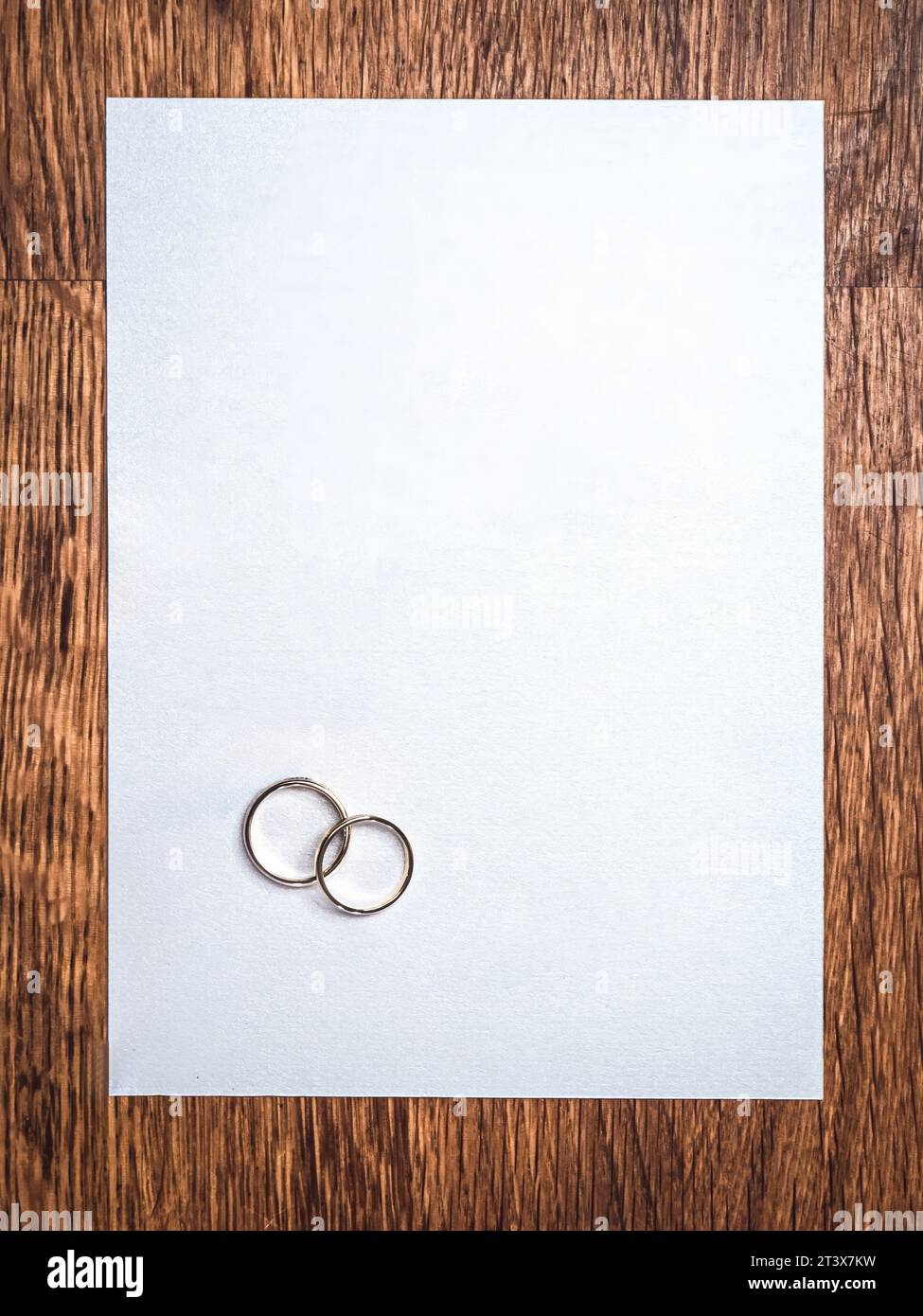 Simple flat lay mockup of a pair of wedding rings on a blank textured ...