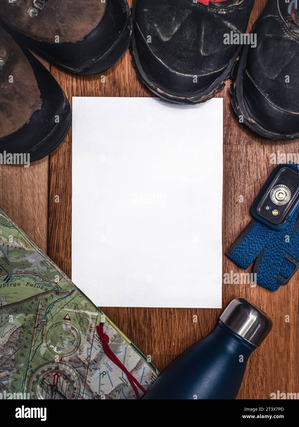 Adventure hiking exploration flat lay mockup with blank paper, headlamp ...