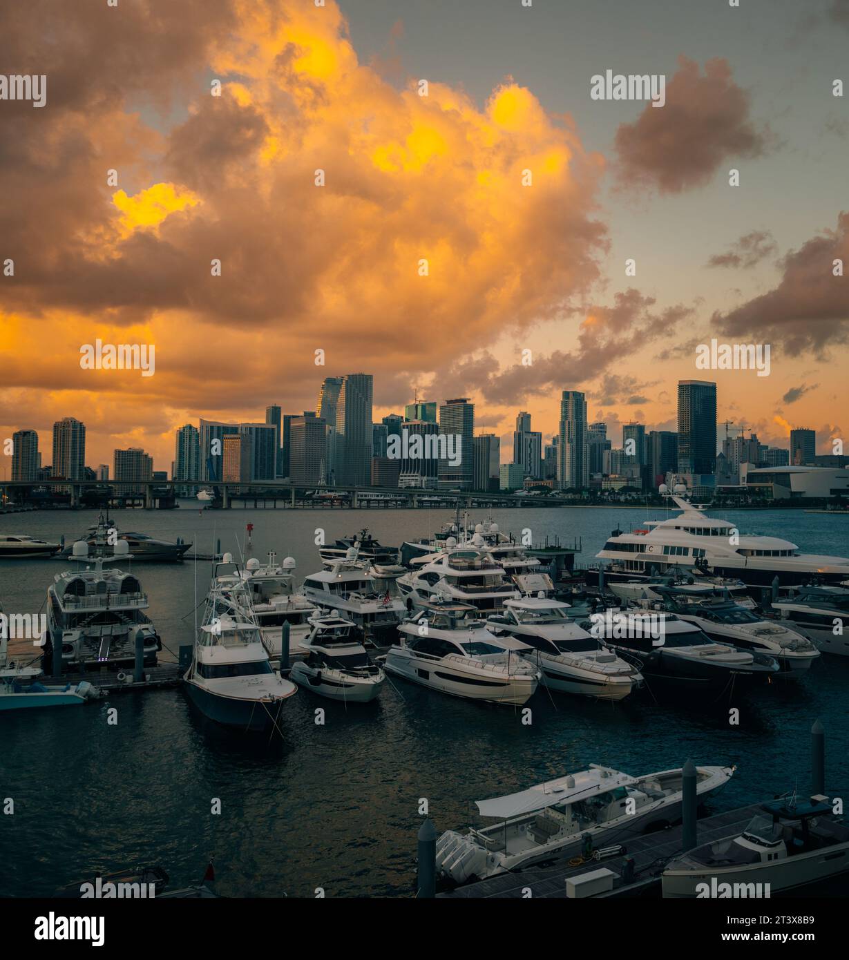Skyline and city bridge with the sun and the sea hi-res stock ...