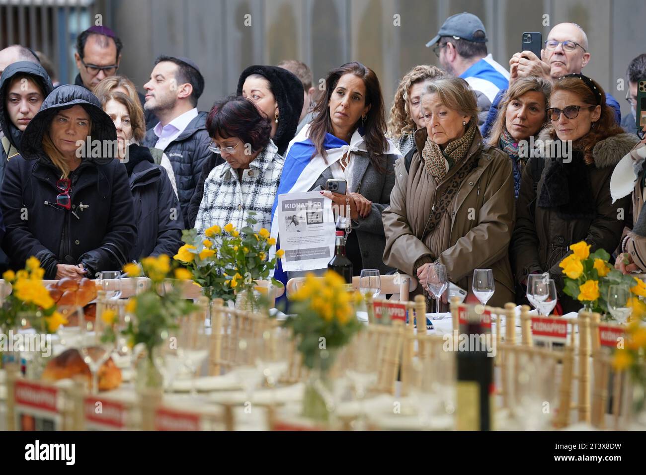 People viewing the Empty Shabbat Table installation, an empty dining ...