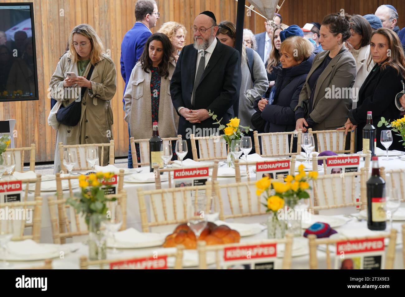 Chief Rabbi Mirvis viewing the Empty Shabbat Table installation, an ...