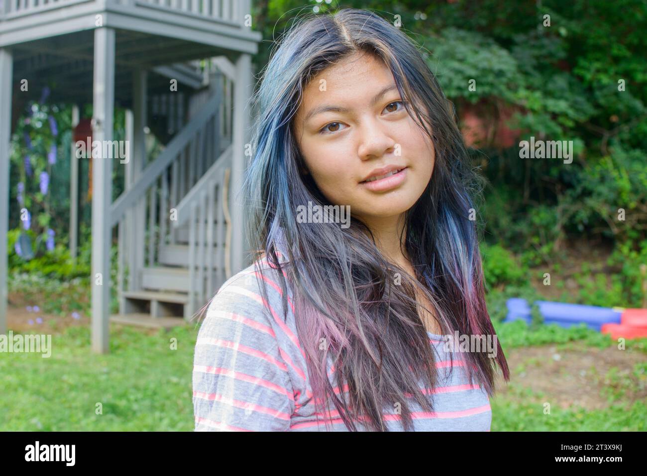 Asian Teen looks toward camera Stock Photo - Alamy