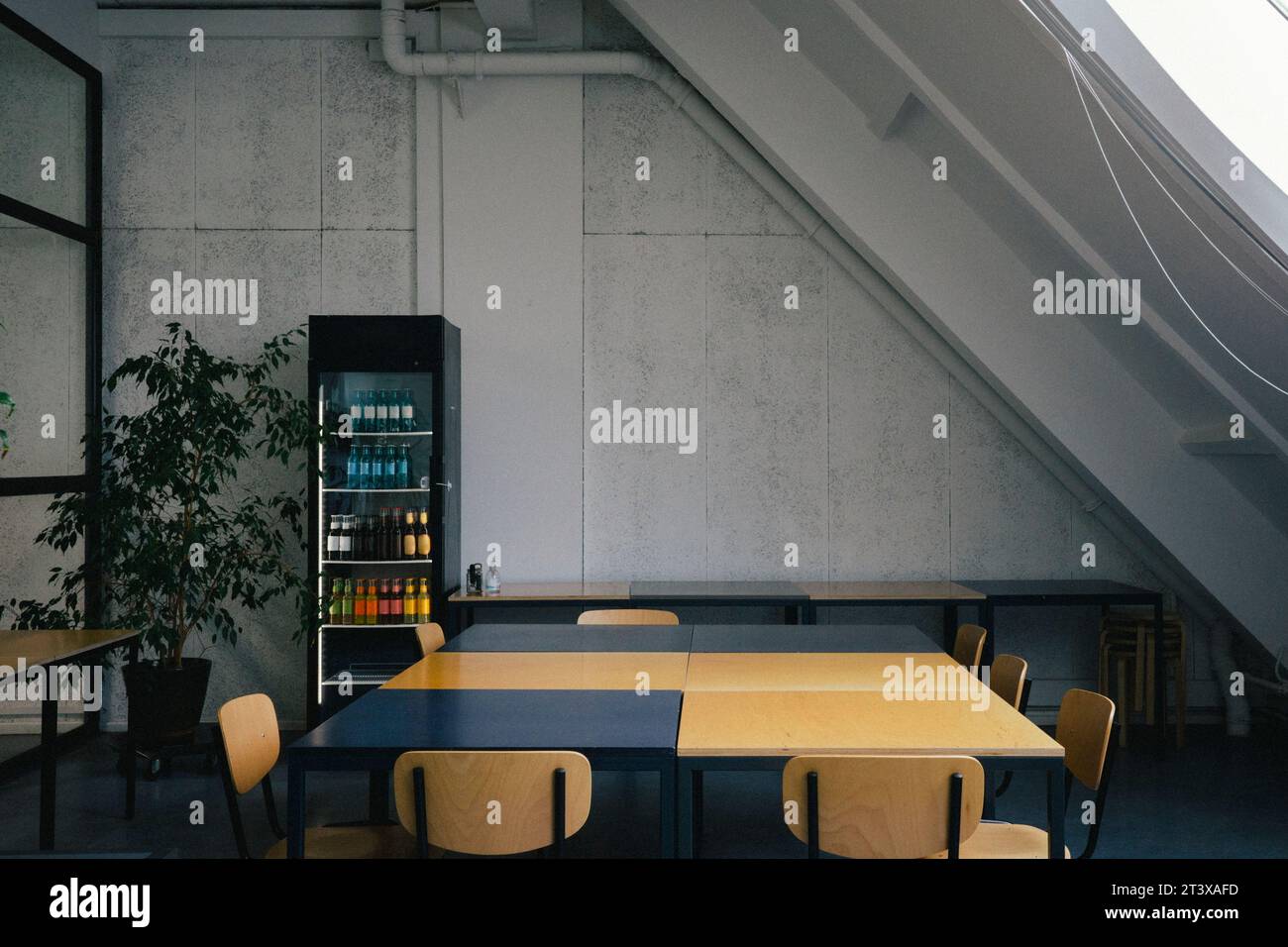 Empty dining table near refrigerator at office cafeteria Stock Photo ...