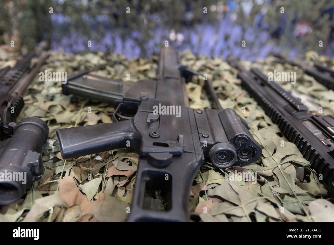 Military rifles on camo background Stock Photo - Alamy