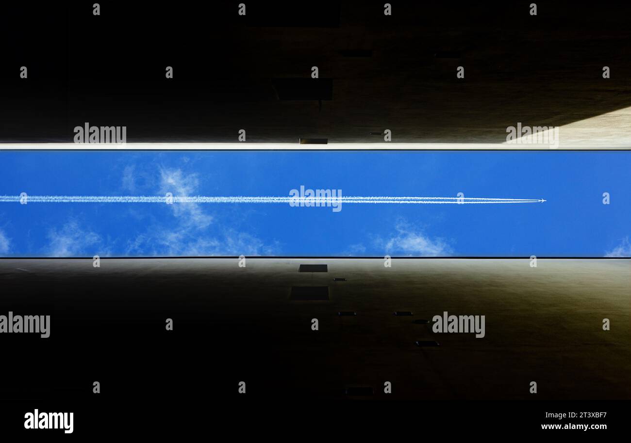 airplane trail on building Stock Photo - Alamy