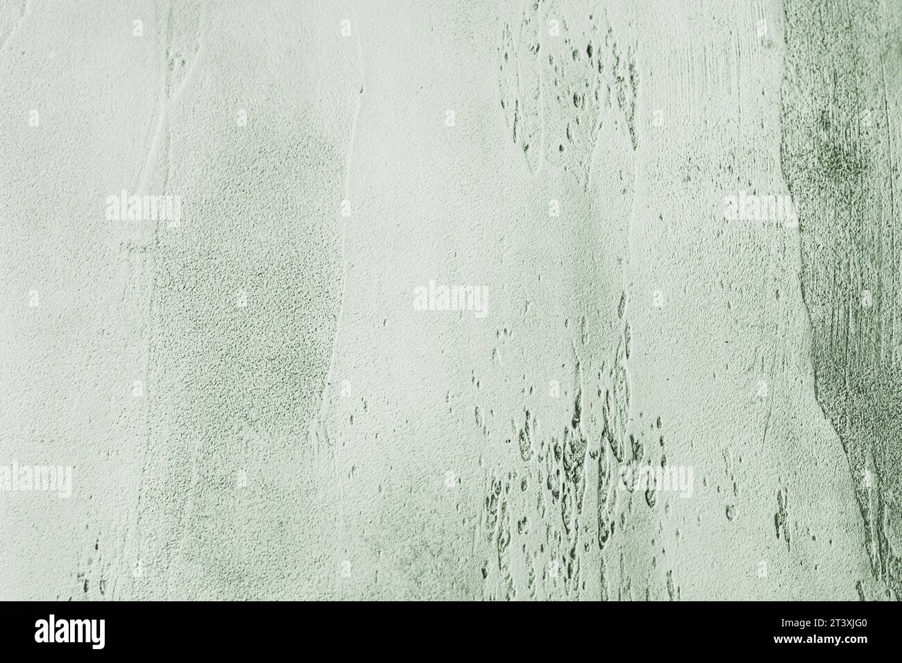 Gray green textured concrete background with light base darker in the ...