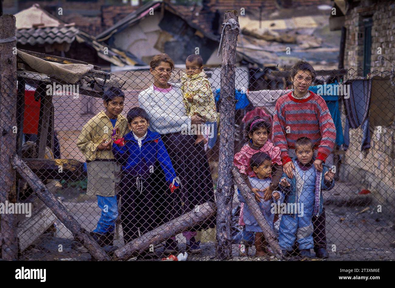 Bulgaria, Sofia . Roma children behind the fence of their living ...