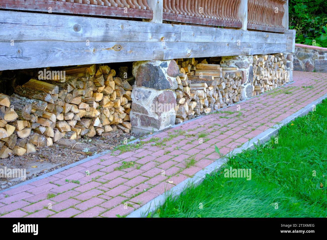 firewood under the foundation of the house. A dry place to store ...