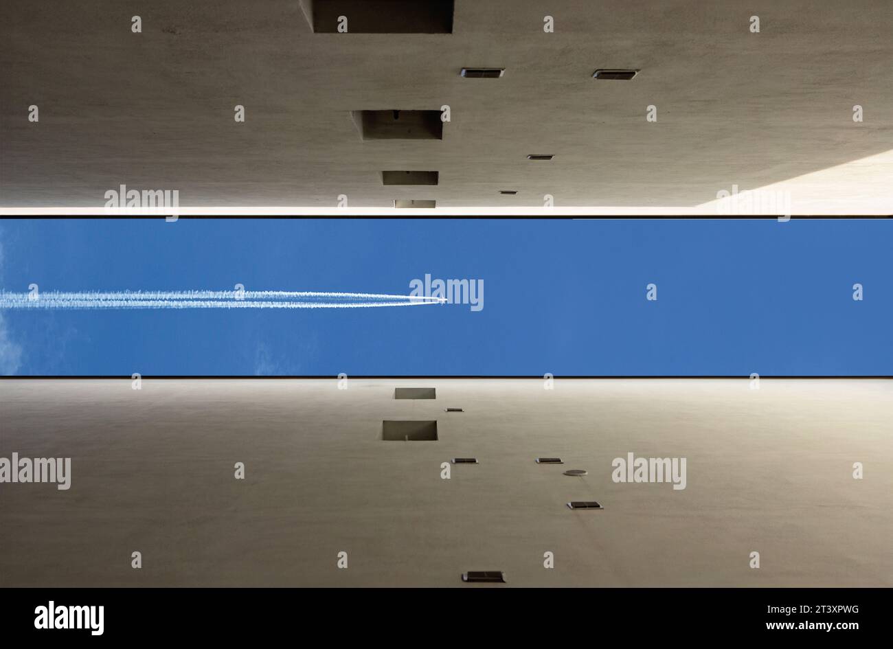 interior of a modern building with airplane trail and clear sky Stock ...