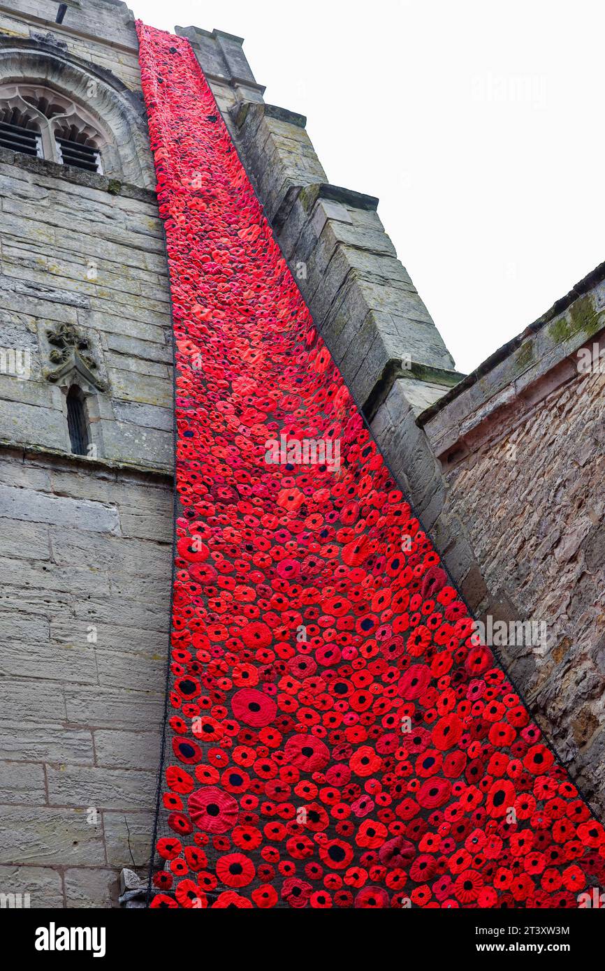 Poppy cascade on a church tower to commemorate Remembrance Day Stock ...