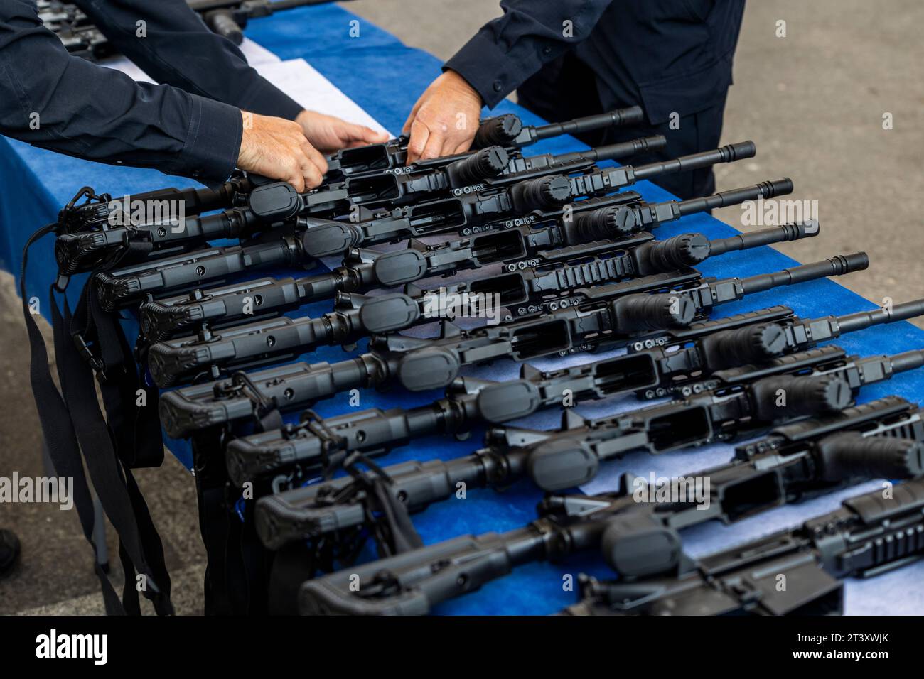 Ashkelon, Israel. 27th Oct, 2023. A police officers sorts M5 automatic ...